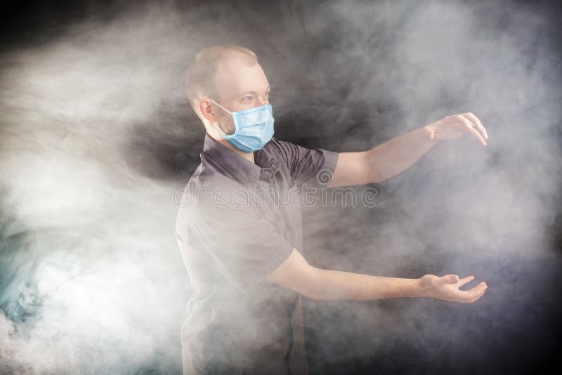 Young Doctor in a Mask in Smoke Stock Photo - Image of horror, doctor ...