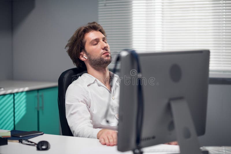 A Young Doctor Meditating in His Office, while Having a Spare Time in ...