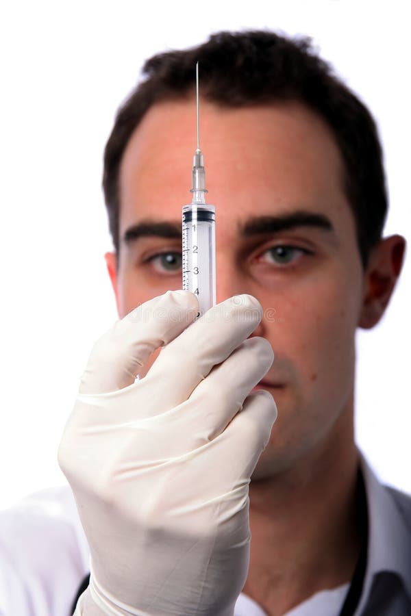 Young Doctor with needle stock photo. Image of practitioner - 5611058