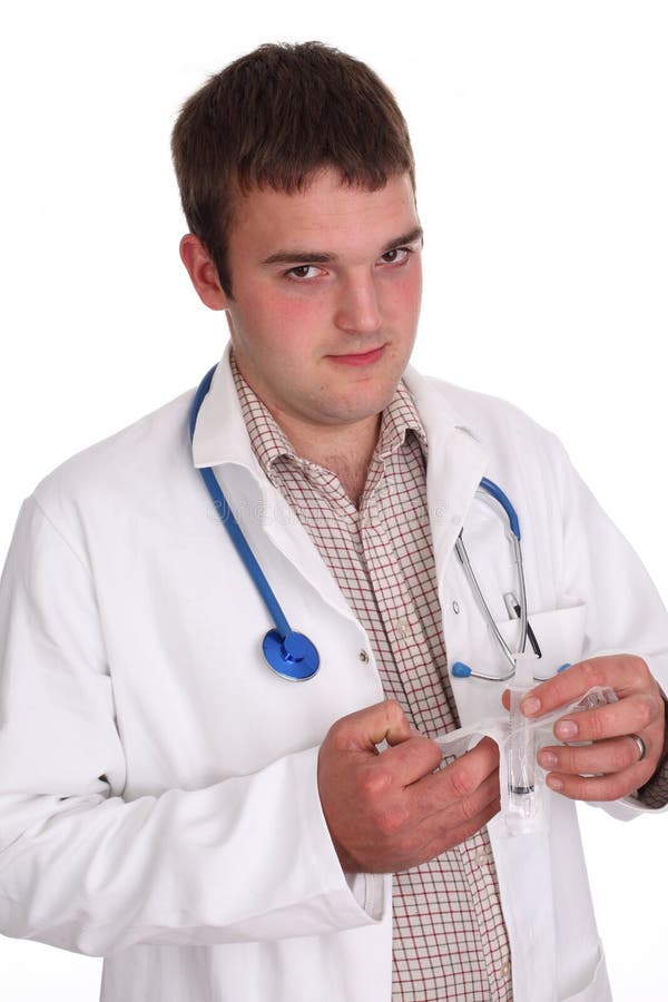 Young Doctor Opening a Syringe Stock Photo - Image of frown, medical ...