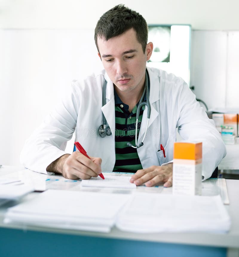 Young Doctor Prescribing Recipe Stock Image - Image of professional ...