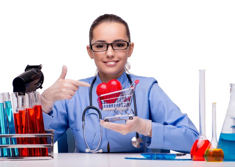 Young Doctor with Red Heart in Lab Stock Photo - Image of nurse, cart ...