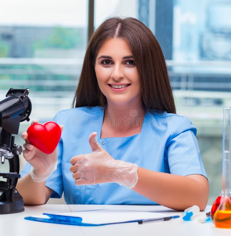 Young Doctor with Red Heart in Lab Stock Image - Image of exam, blood ...