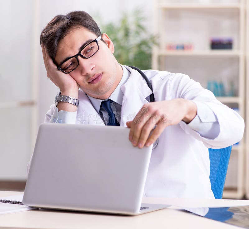 Young Doctor Sitting in the Office Stock Image - Image of hospital ...
