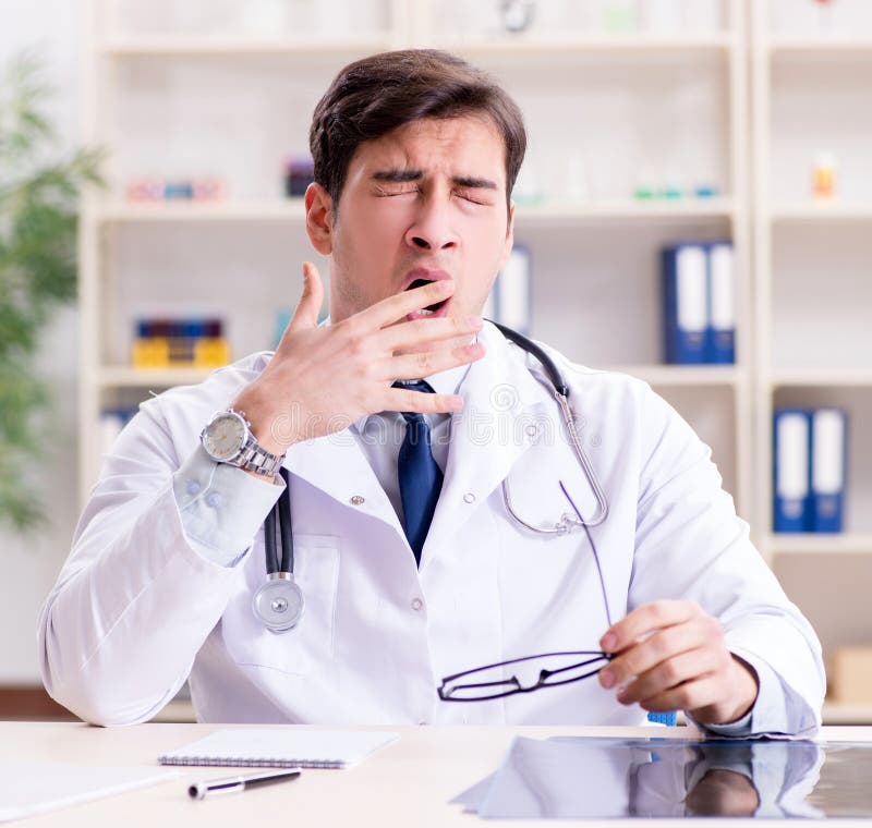 Young Doctor Sitting in the Office Stock Image - Image of shift, clinic ...