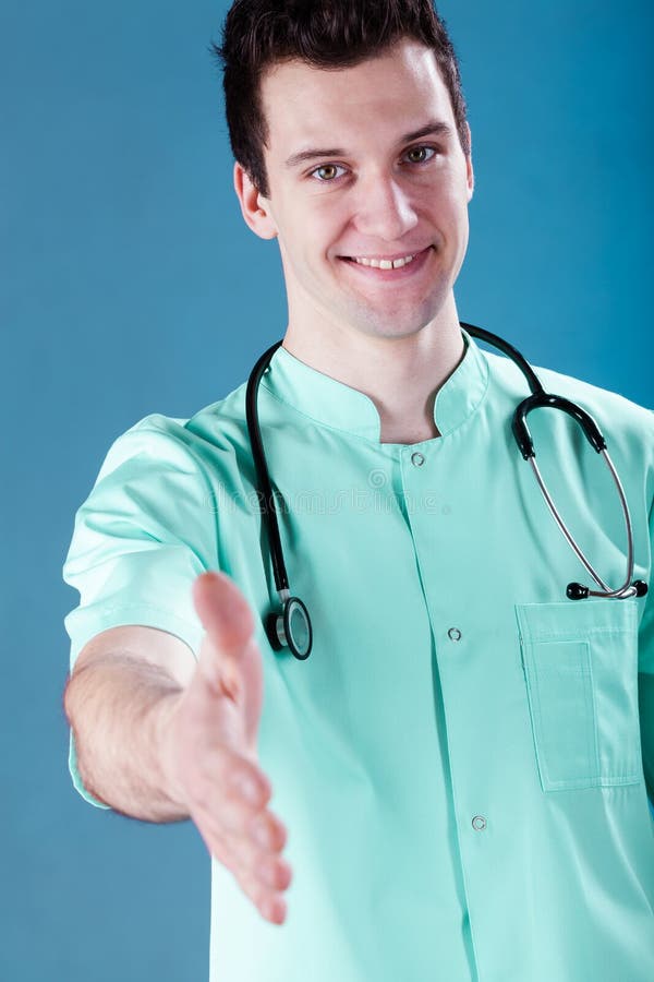 Doctor smiling at patient stock image. Image of medical - 107744153