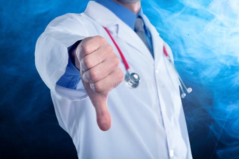 Young Doctor with a Stethoscope Shows Bad Sign with His Hands Stock ...