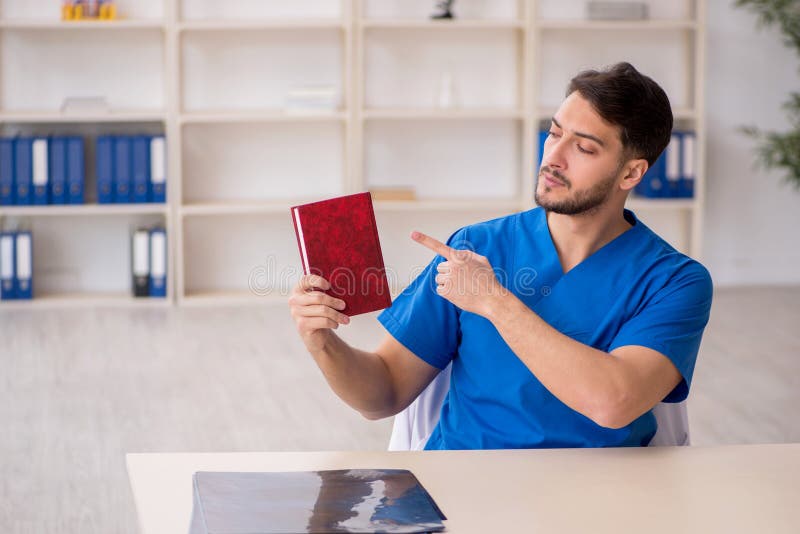 Young Male Doctor Student Reading Book Stock Photo - Image of learning ...
