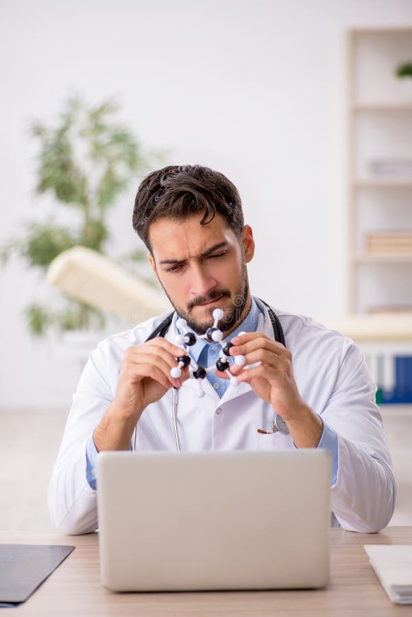 Young Male Doctor Studying Molecular Model Stock Photo - Image of ...