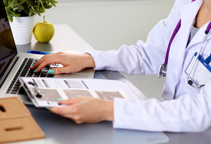 Young Doctor at the Table is Receiving Patient Stock Image - Image of ...