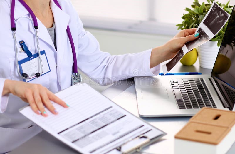Young Doctor at the Table is Receiving Patient Stock Image - Image of ...