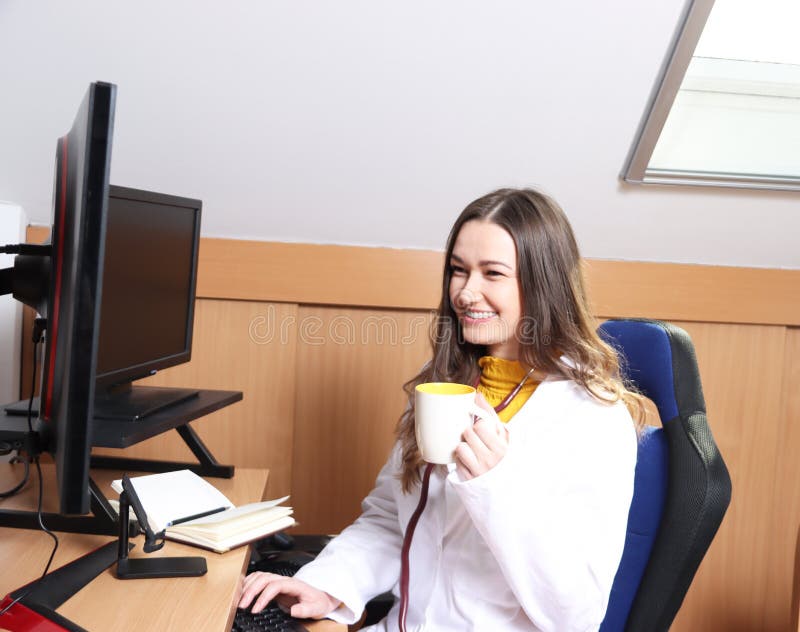 She Works in an Office on a Computer. 2 Stock Image - Image of ...