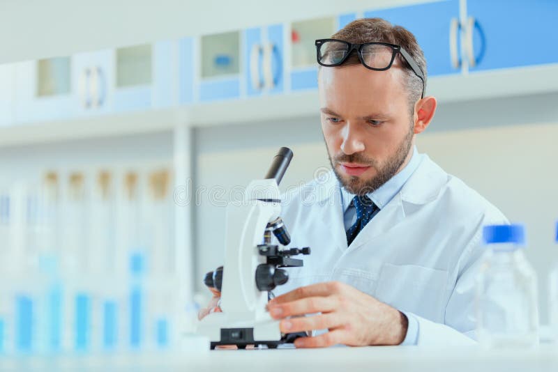 Young Doctor in Uniform Working at Testing Laboratory at Clinic Stock ...