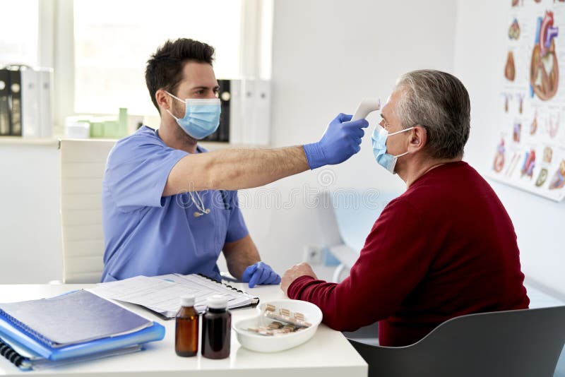 Doctor Using Thermometer Gun To Check Body Temperature Stock Photo ...