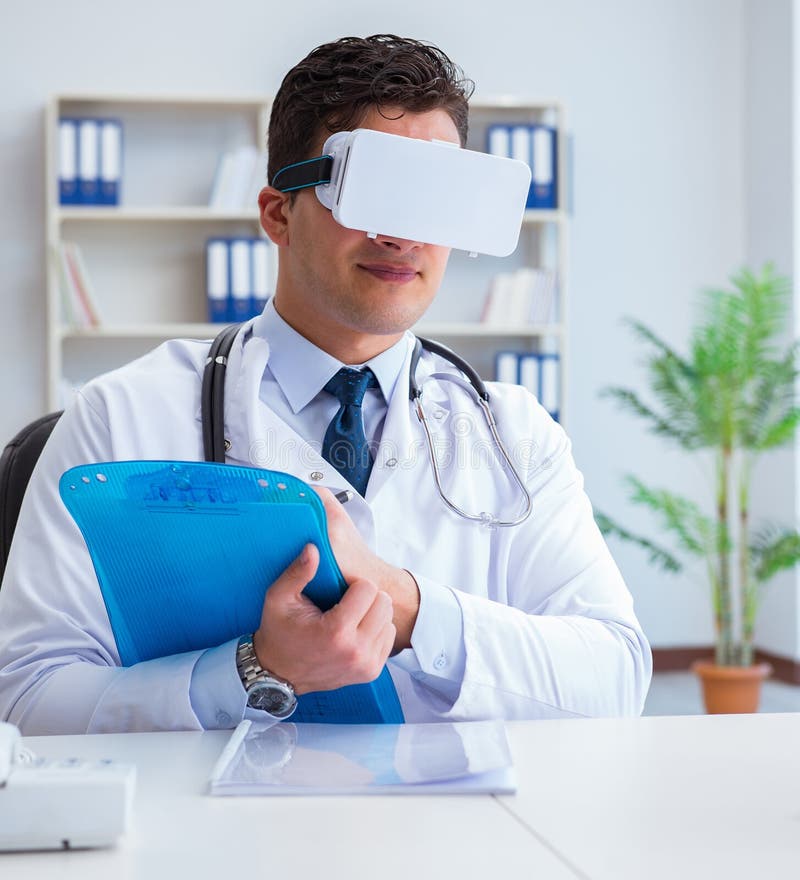 Young Doctor with Vr Virtual Reality Headset Working in the Offi Stock ...