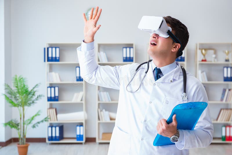 Young Doctor with Vr Virtual Reality Headset Working in the Offi Stock ...