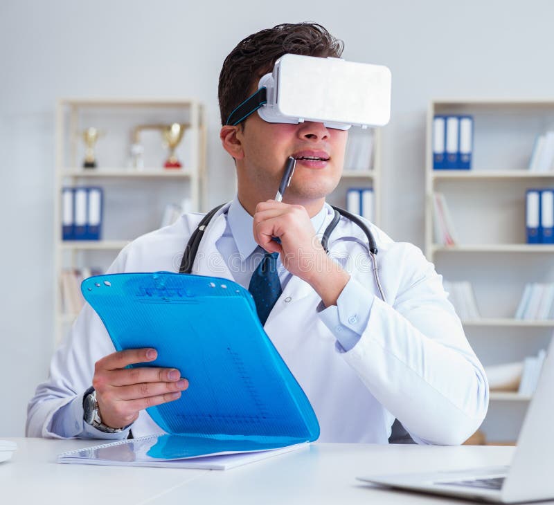 Young Doctor with Vr Virtual Reality Headset Working in the Offi Stock ...