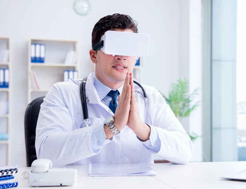 Young Doctor with Vr Virtual Reality Headset Working in the Offi Stock ...