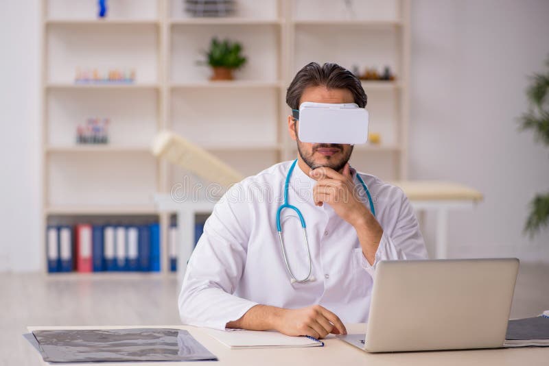Young Male Doctor Wearing Virtual Glasses Stock Photo - Image of ...