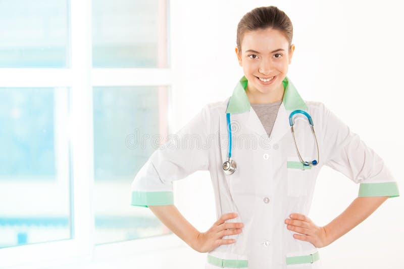 Young Doctor in White and Green Coat Stock Image - Image of person ...