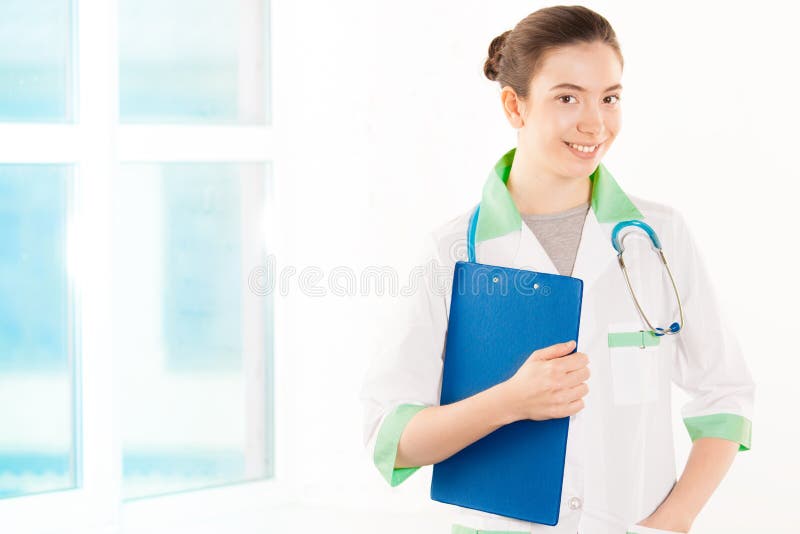 Young Doctor in White and Green Coat with Tablet Stock Photo - Image of ...