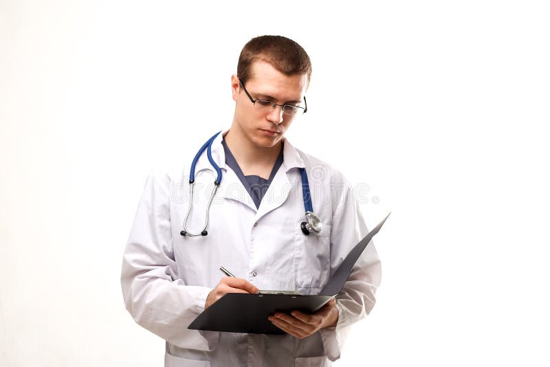 Young Doctor in White Lab Coat on White Background Writes Stock Photo ...