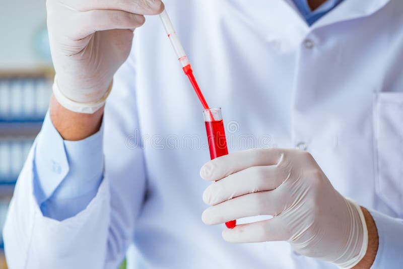 The Young Doctor Working on Blood Test in Lab Hospital Stock Photo ...