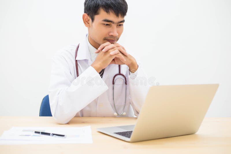 Young Doctor Working in His Office Stock Photo Stock Image - Image of ...