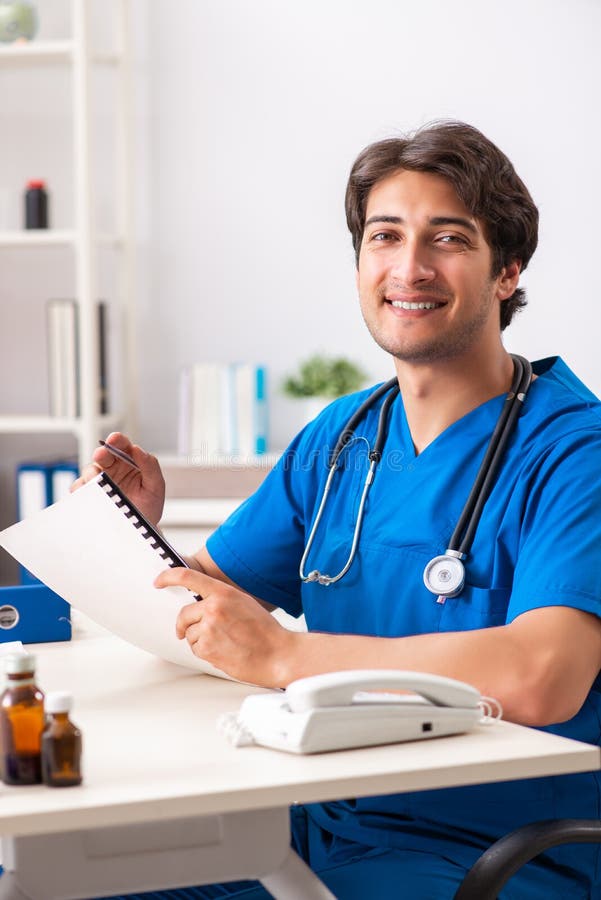 The Young Doctor Working in the Hospital Stock Photo - Image of ...