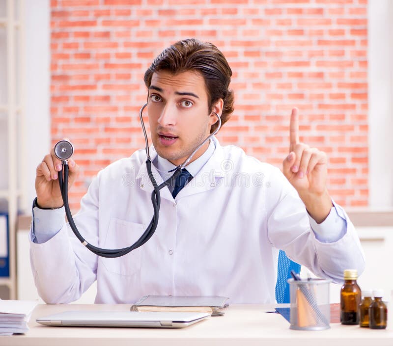 Young Doctor Working in the Hospital Stock Photo - Image of computer ...