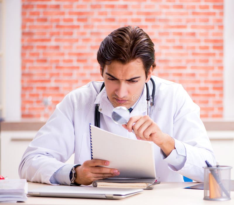 Young Doctor Working in the Hospital Stock Photo - Image of computer ...