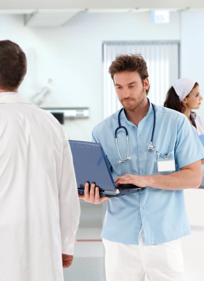 Young Doctor Working with Laptop in Hospital Stock Photo - Image of ...