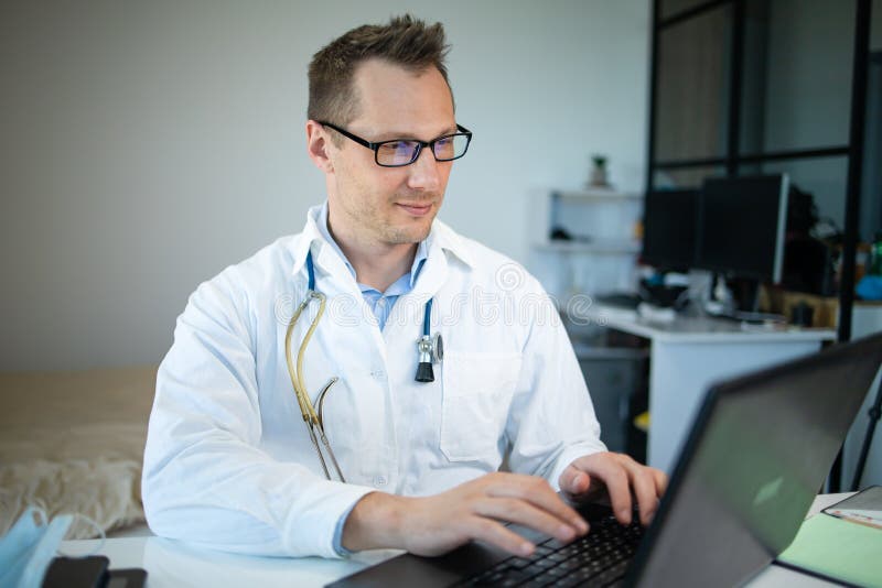 The Doctor Works with a Laptop and Writes Documents. Reference ...