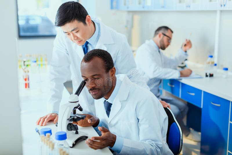 Young Doctors in Uniform Working at Testing Laboratory Stock Photo ...