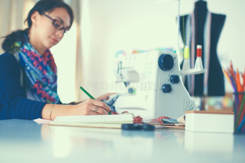 Young Dressmaker Designing Clothes Pattern on Paper Stock Image - Image ...