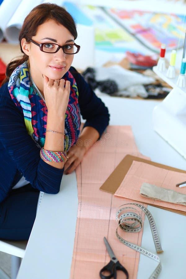 Young Dressmaker Designing Clothes Pattern on Paper Stock Photo - Image ...