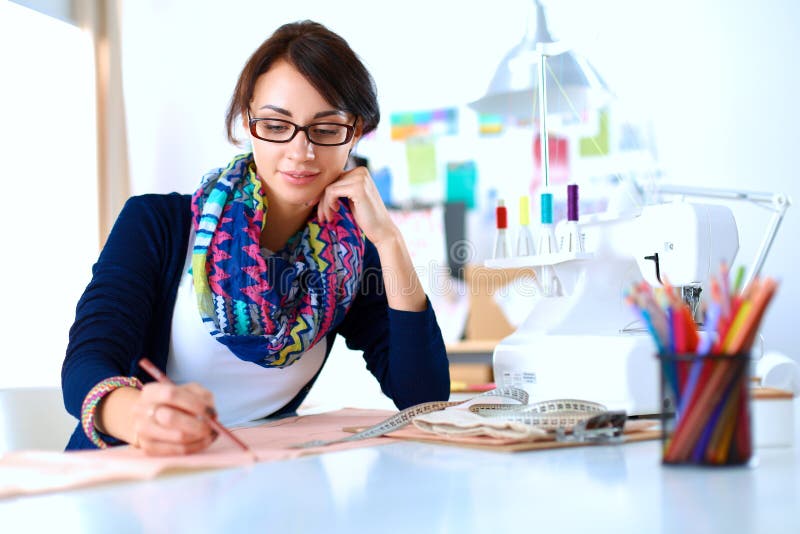 Young Dressmaker Designing Clothes Pattern on Paper Stock Photo - Image ...