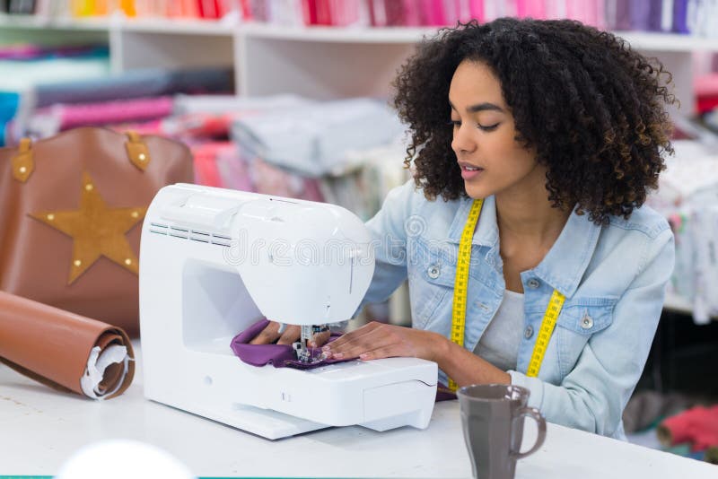Young dressmaker at work stock image. Image of equipment - 196838759