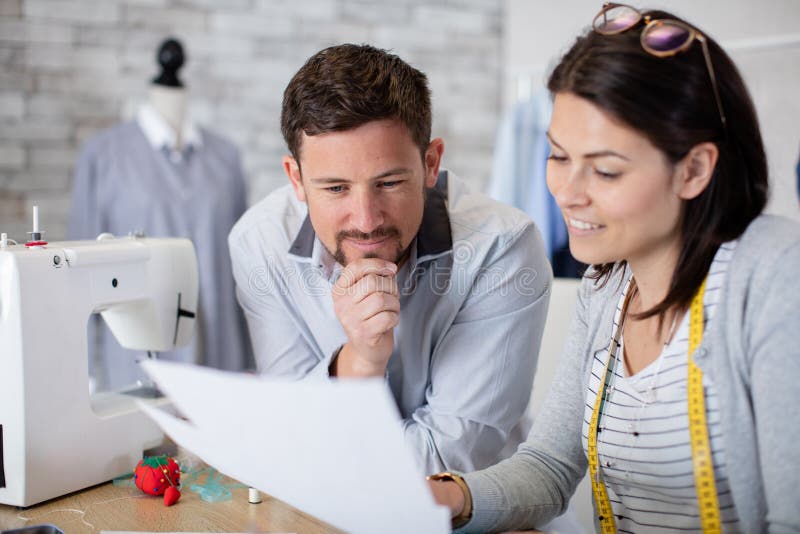 Young Dressmakers Working on Rough Outline Designs at Workshop Stock ...