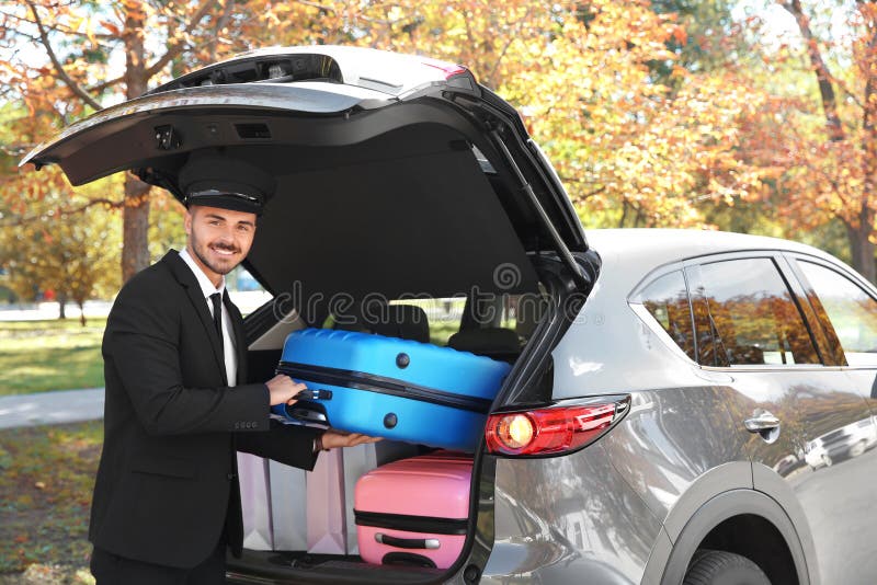 Young Driver Loading Suitcases into Car Trunk Stock Photo - Image of ...