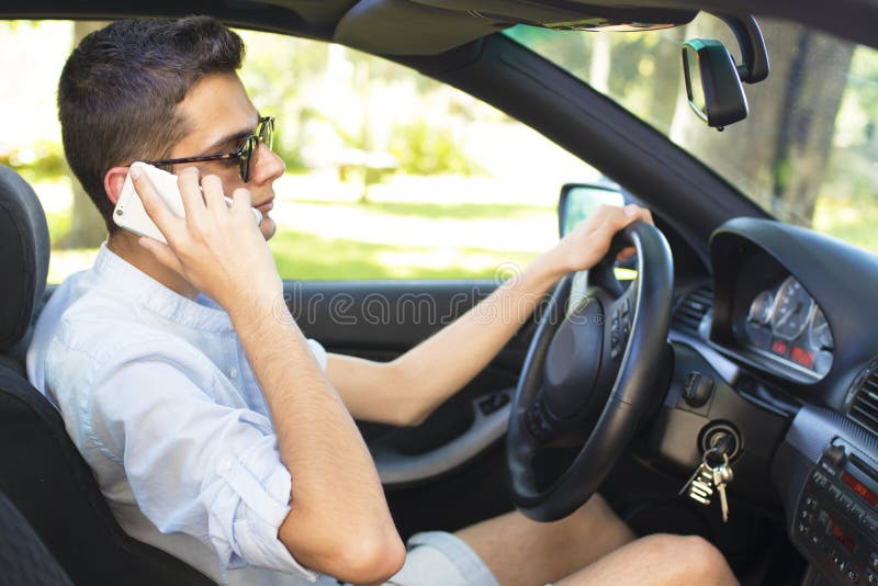 Driving and talking stock photo. Image of phone, communications - 687528