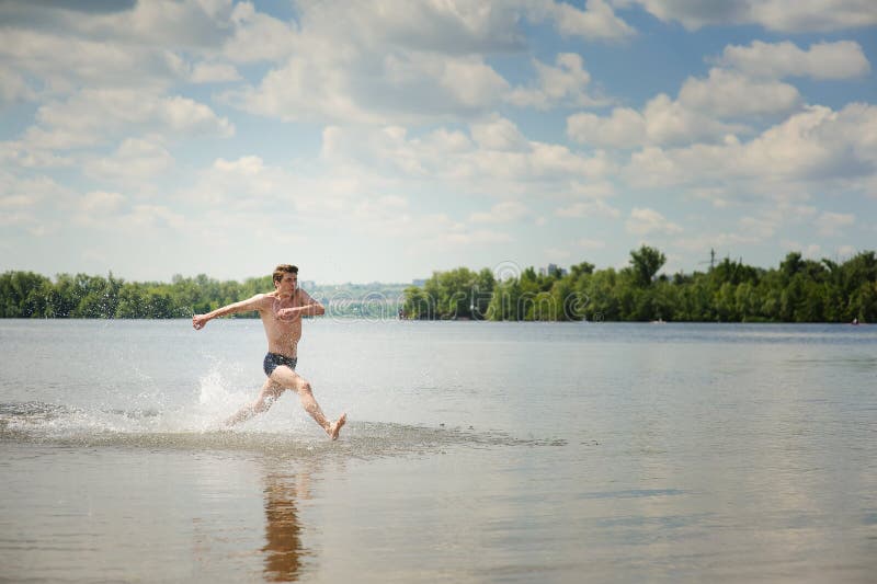 Young Dynamic Man Runs in Water Stock Image - Image of dynamic, healthy ...