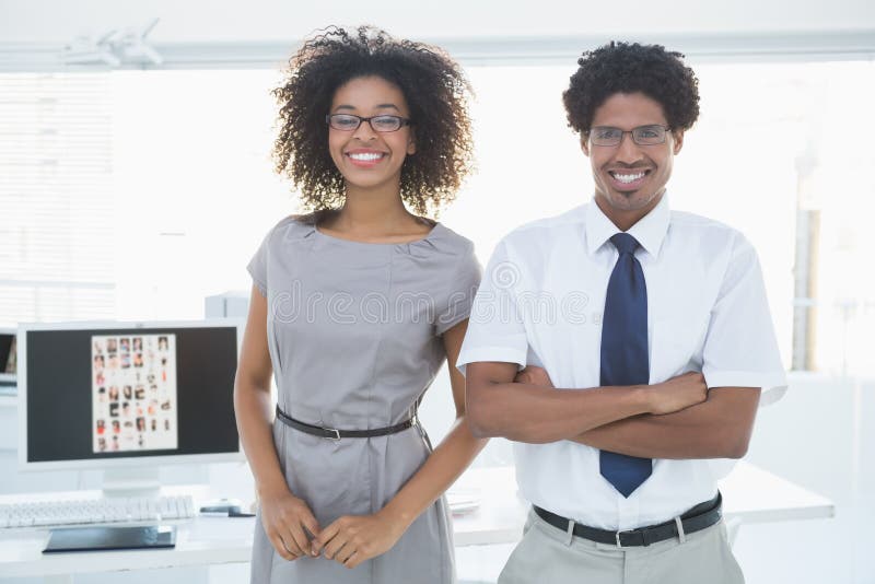 Young Editorial Team Smiling at Camera Together Stock Image - Image of ...