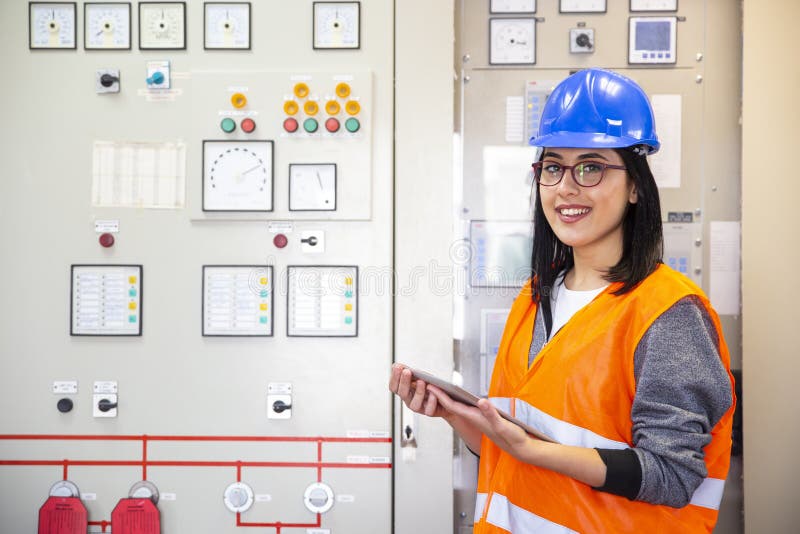 Young Businesswoman Standing in Front of the Control Panel in the ...