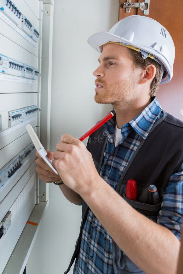 Young Electrician Working on Electric Panel Stock Photo - Image of ...
