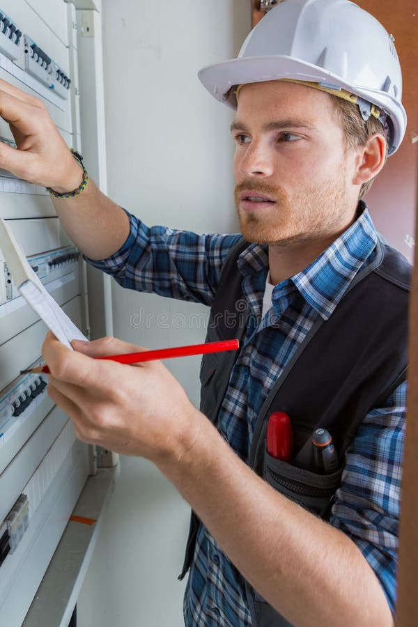 Young Electrician Working on Electric Panel Stock Image - Image of male ...