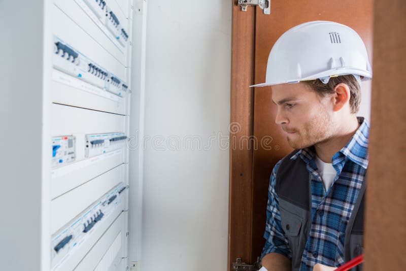 Young Electrician Working on Electric Panel Stock Photo - Image of ...