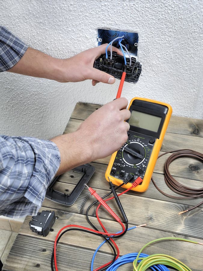 Young Electrician Working in a Residential Electrical Installation ...