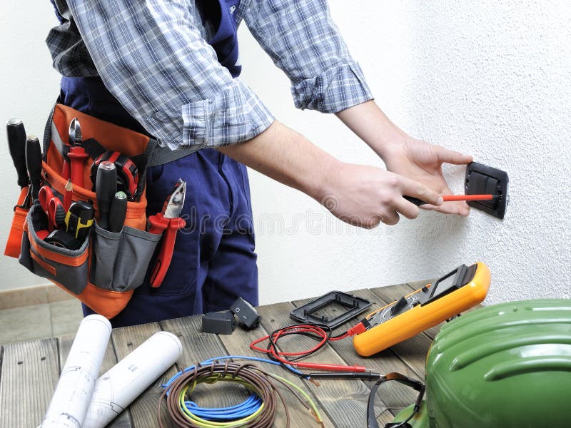 Young Electrician Working in a Residential Electrical Installation ...