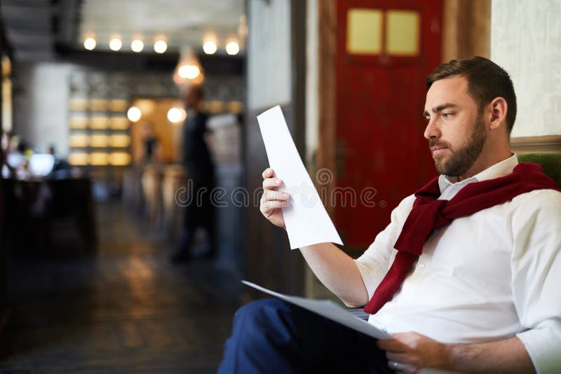Looking through papers stock photo. Image of concentration - 121880608